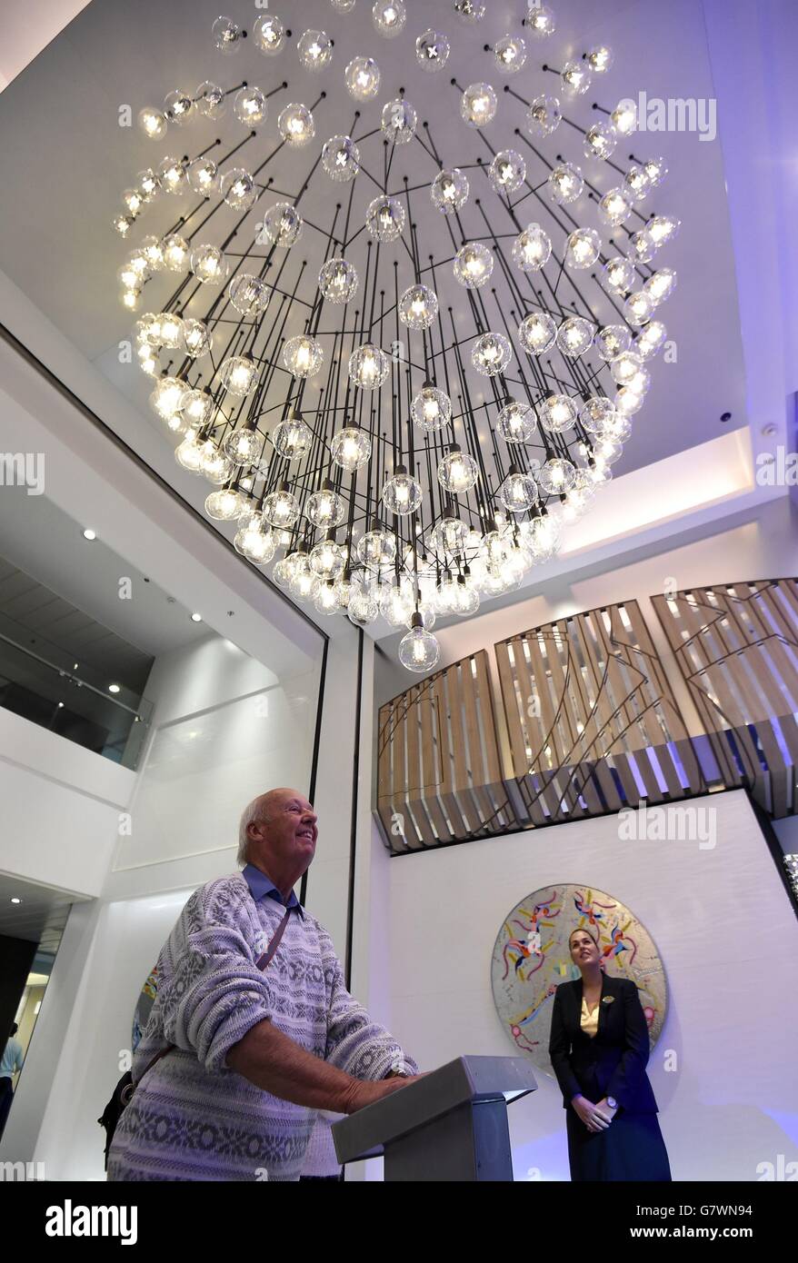 A guest places their hands on the Pulse Spiral console which makes 200 ...