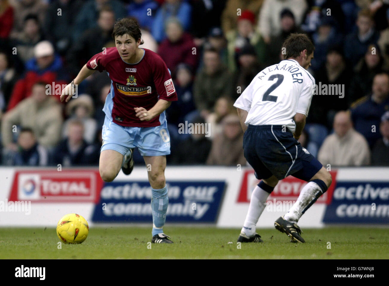 Burnleys john oster goes past preston north ends graham alexander hi ...