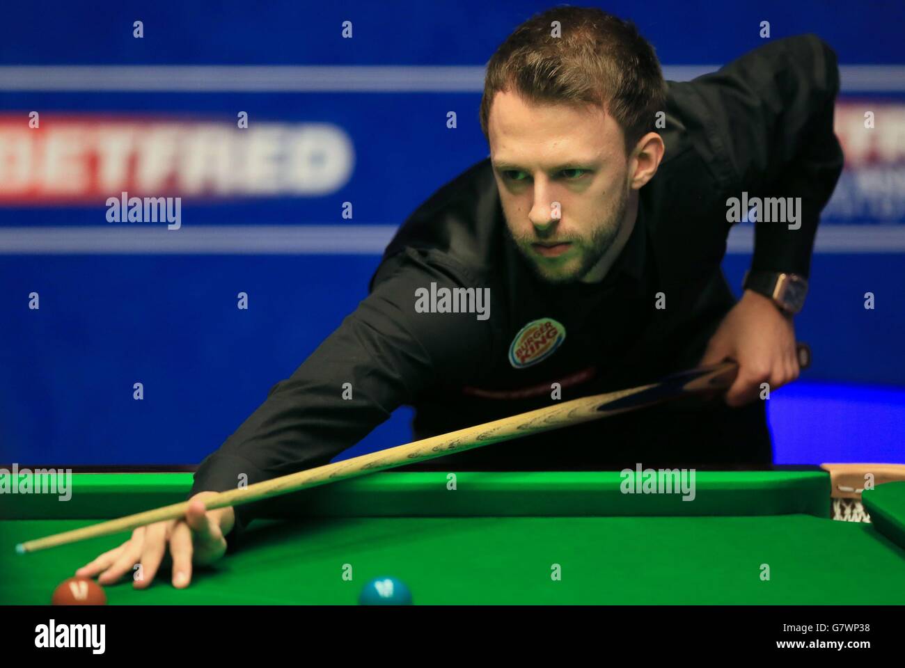 Judd Trump in action against Stuart Carrington during day five of the ...