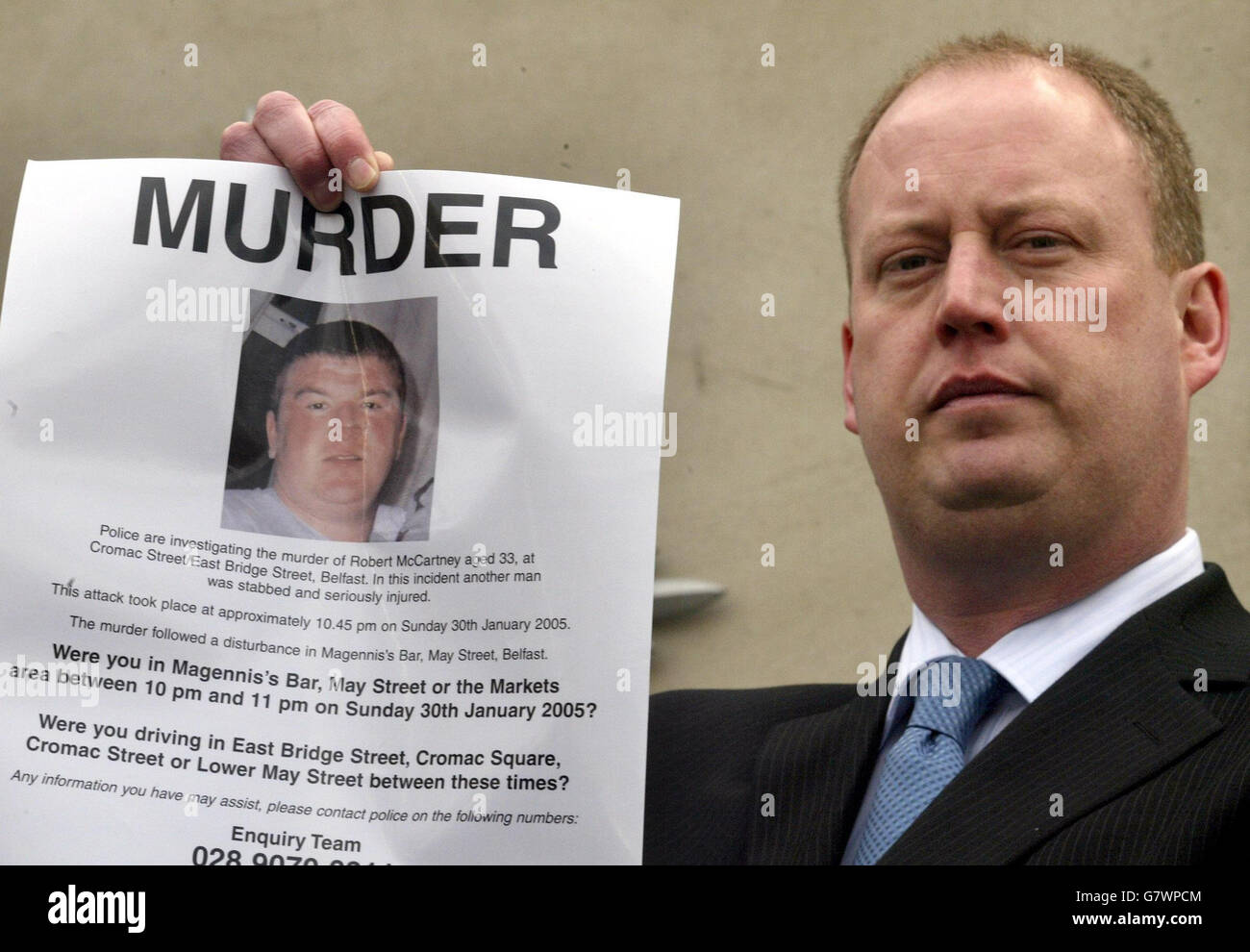 Detective Superintendent George Hamilton speaking at a news conference ...