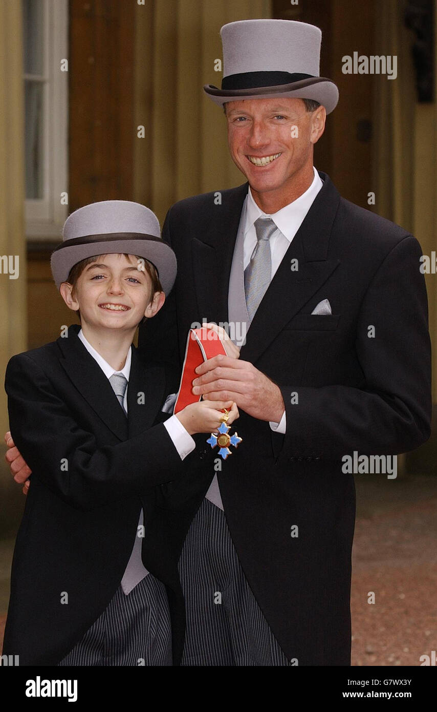 Astronaut Dr Michael Foale and his son Ian, 10, with his CBE after he ...