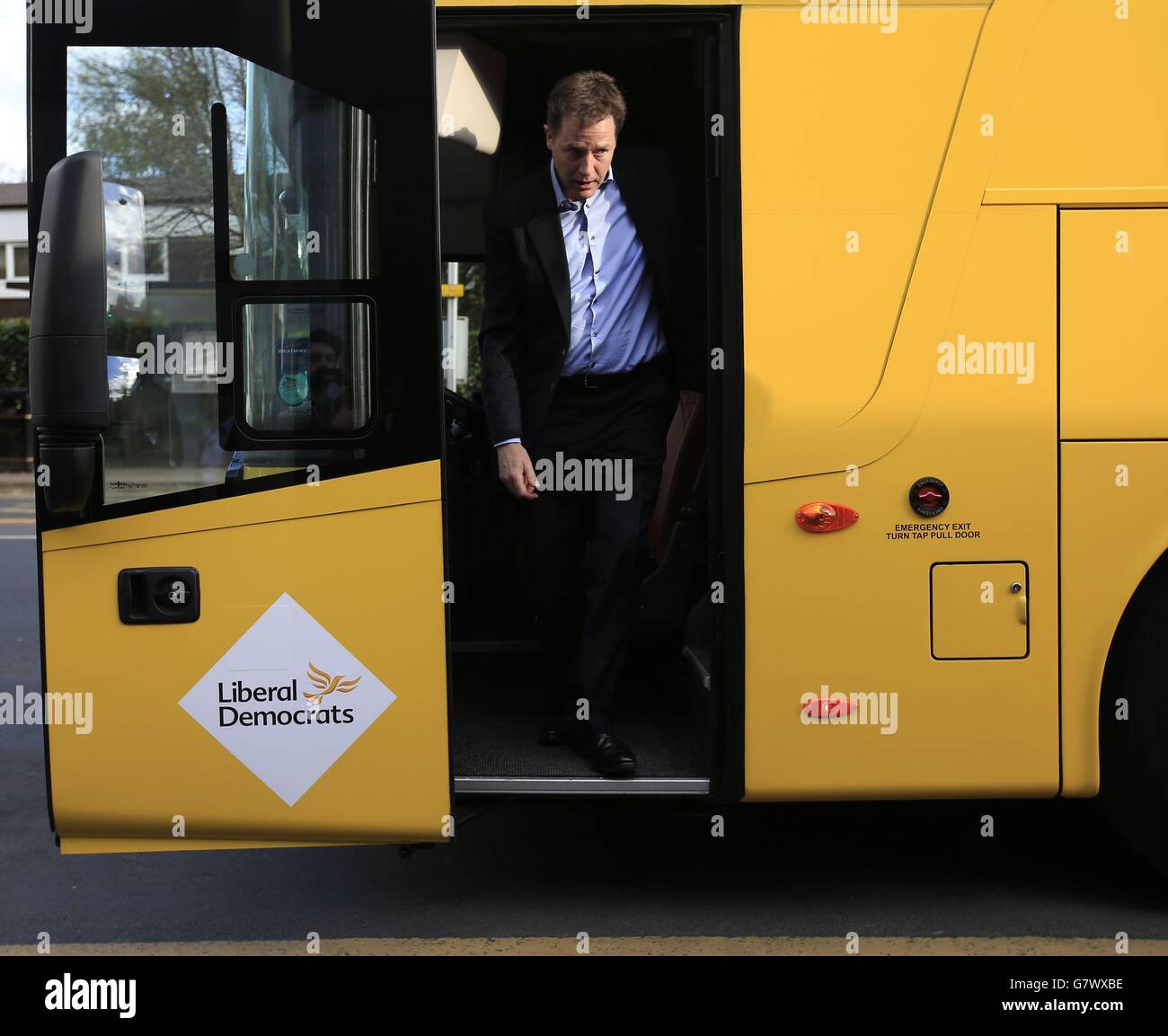 Nick Clegg emerges from the Liberal Democrat tour bus for a visit to ...