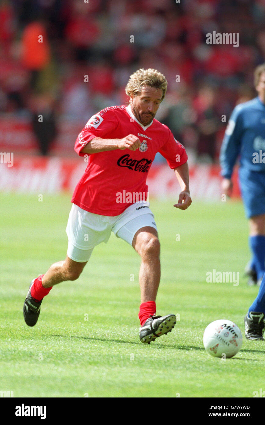 Rod Stewart playing in a celebrity match before the start of the Coca ...