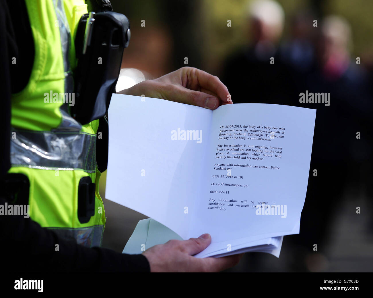 Police hand out leaflets to members of the public who attended the ...