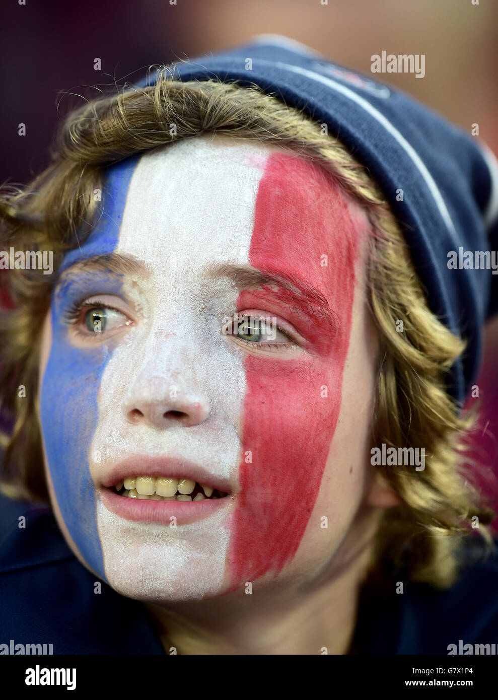 A paris saint germain fan wearing face paint in the stands hi-res stock ...