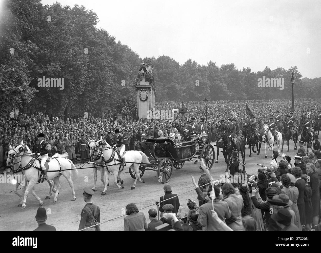 In a State Landau drawn by Windsor greys, their Majesties the King and ...