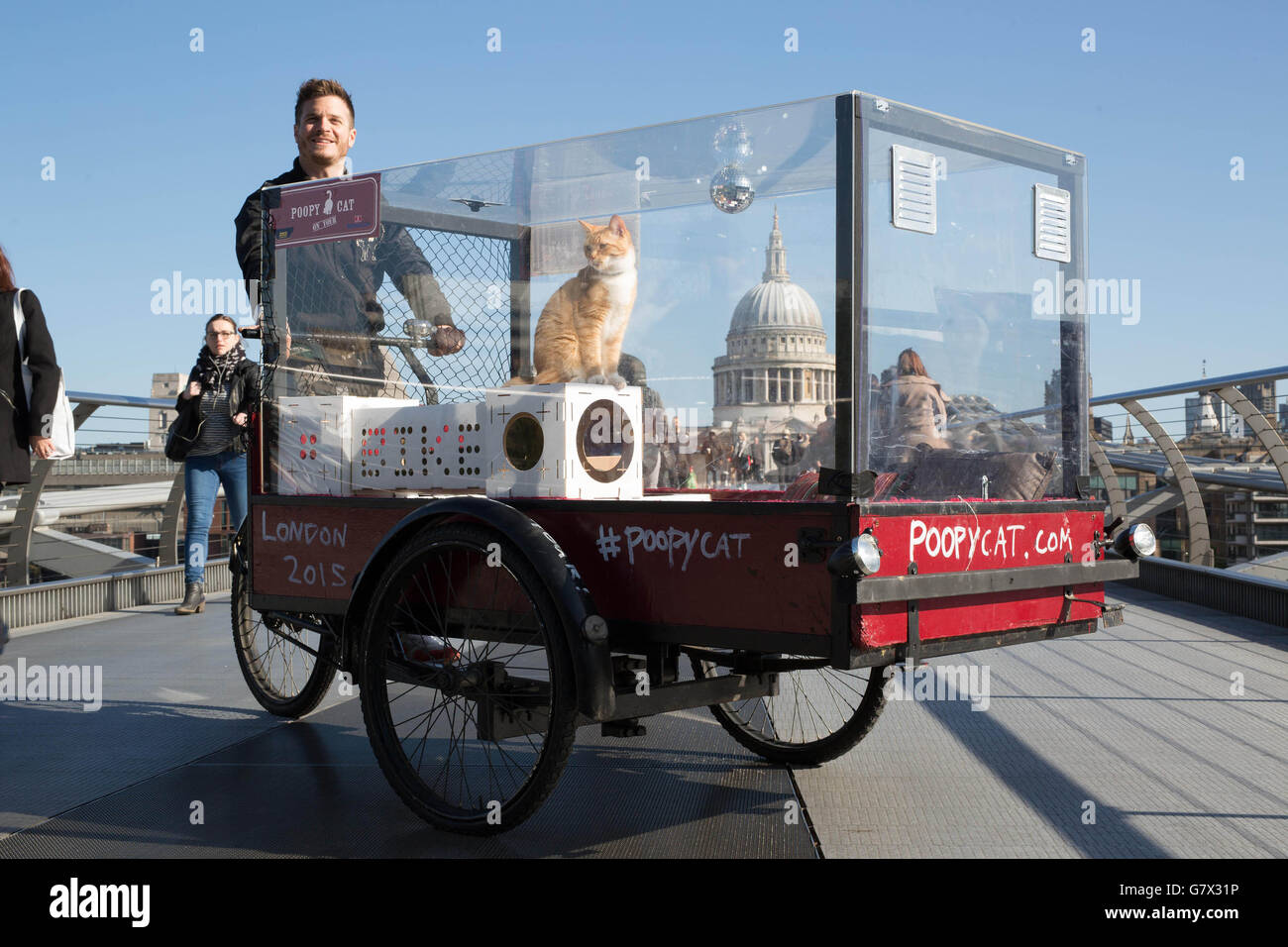 Poopy Cat Founder, Thomas Vles rides across Millennium Bridge in London ...