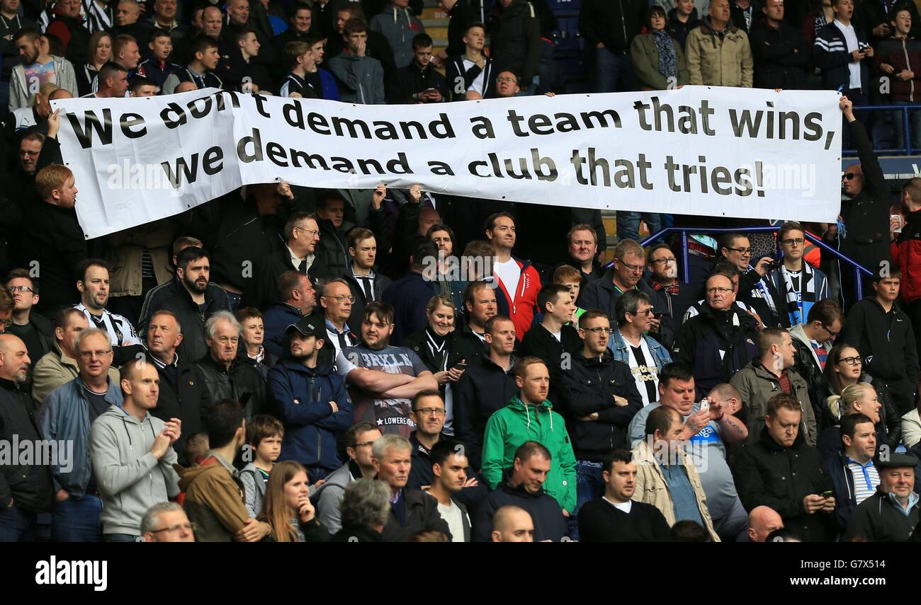 Newcastle United supporters hold up a banner during the game against ...
