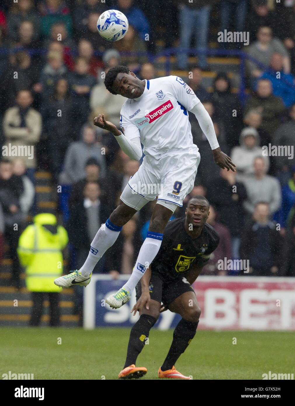 Tranmere Rovers' Kayode Odejayi (top) battle with Bury's Nathan Cameron ...