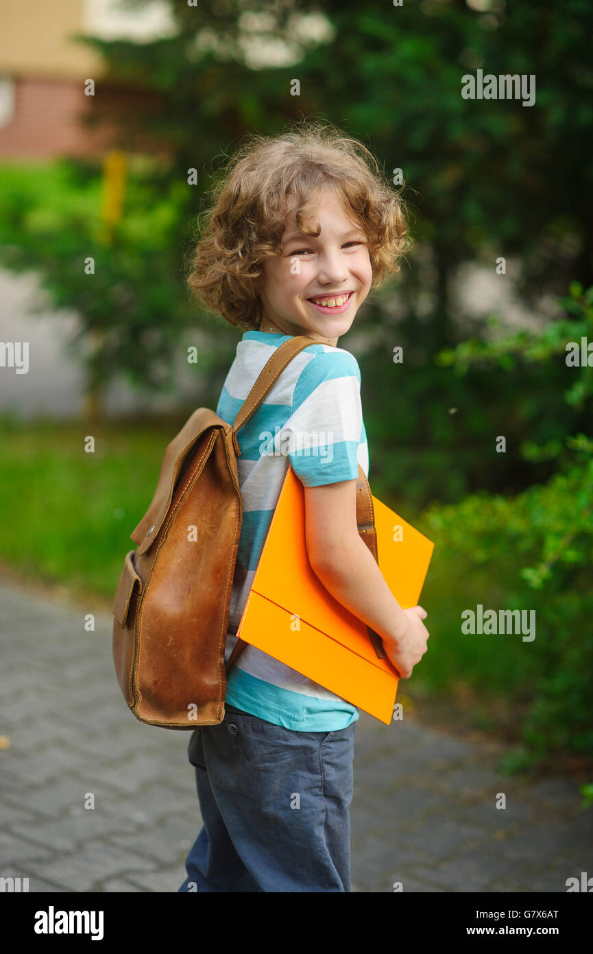 The pupil of elementary school on a schoolyard. The school student ...