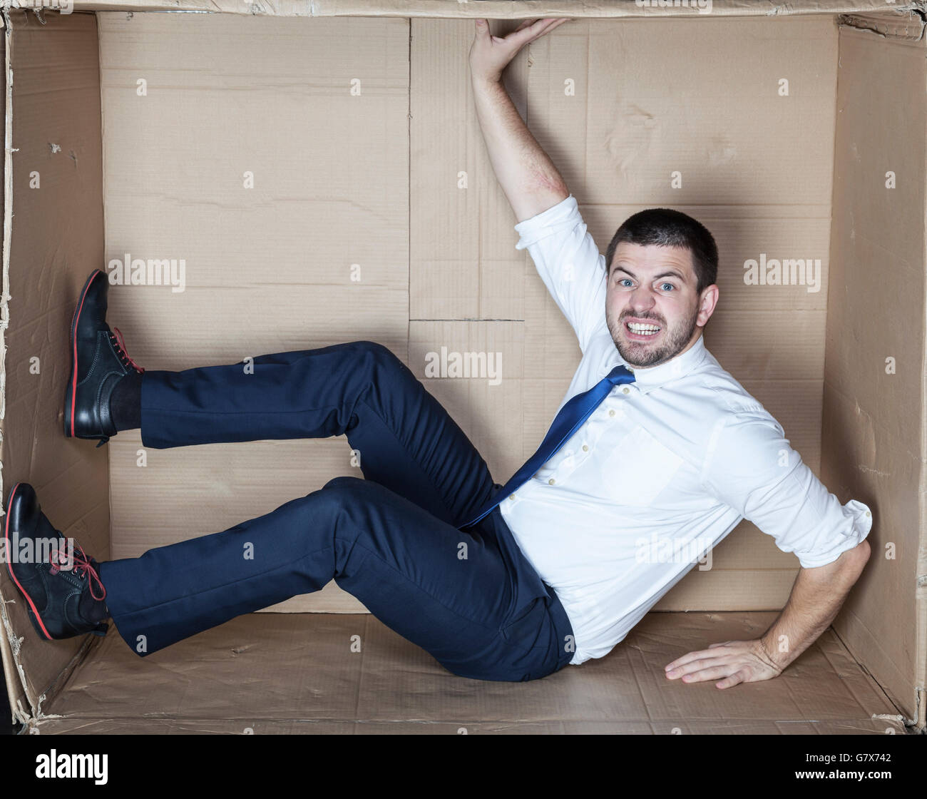 Tight space sitting hi-res stock photography and images - Alamy