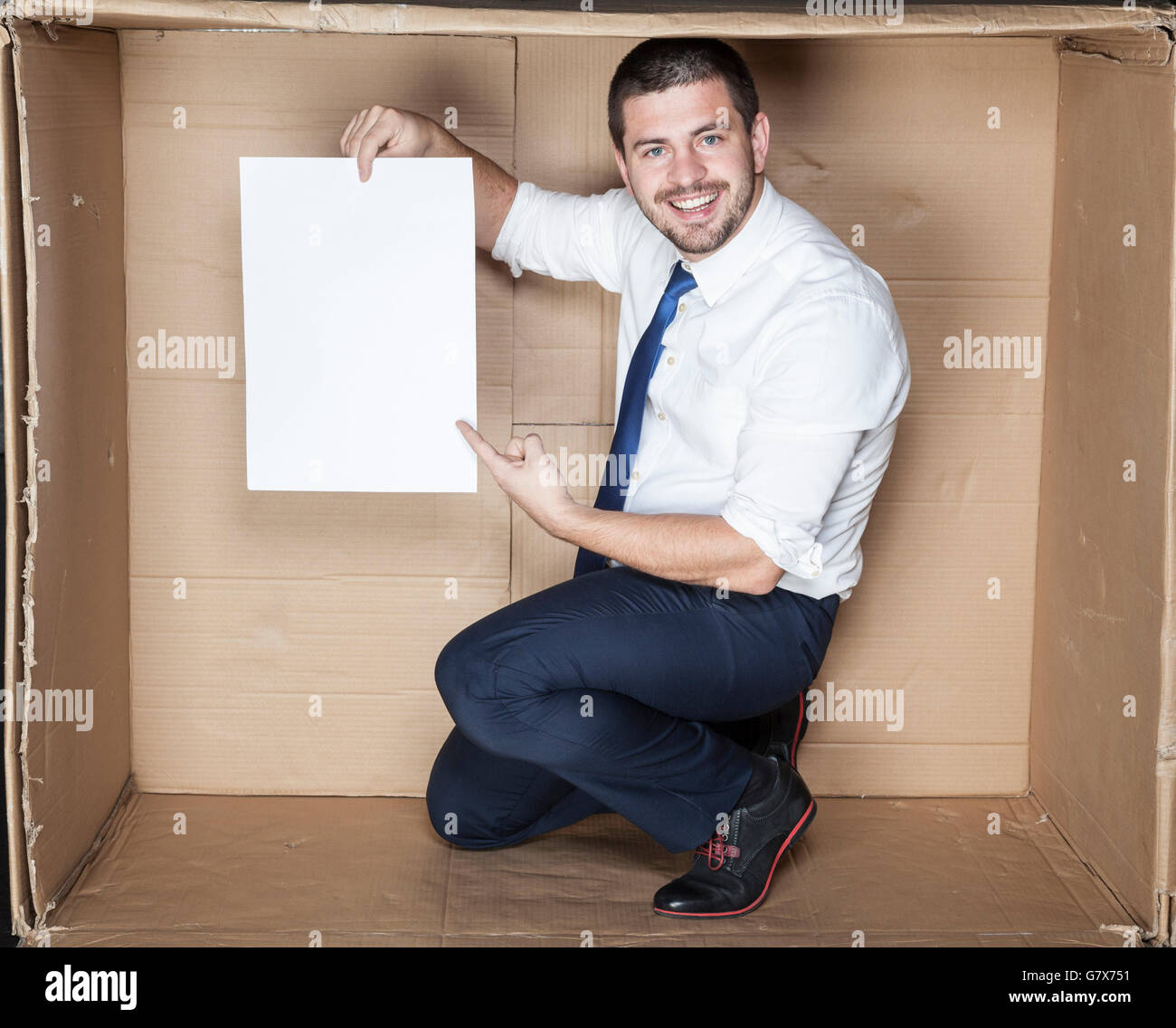 businessman pointing sheet of paper Stock Photo - Alamy