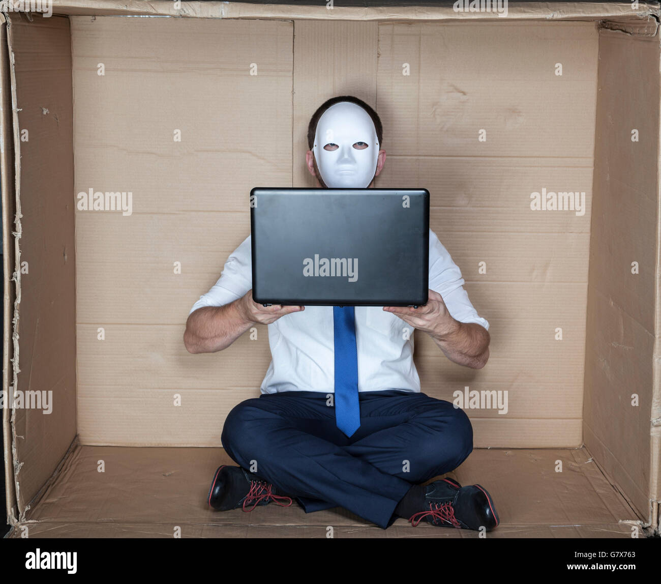 hacker holds a computer Stock Photo - Alamy