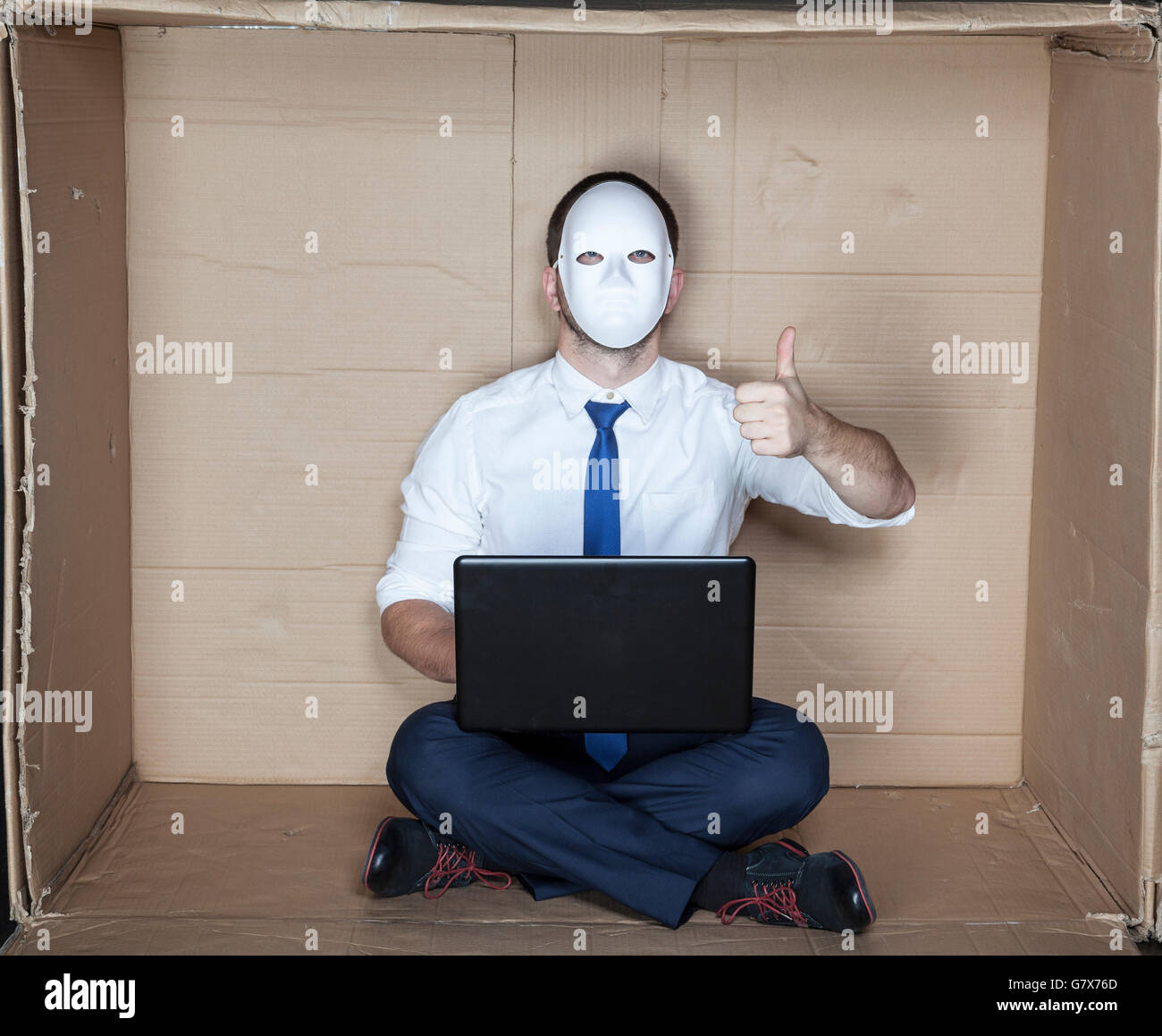 hacker with the thumb upwards Stock Photo - Alamy