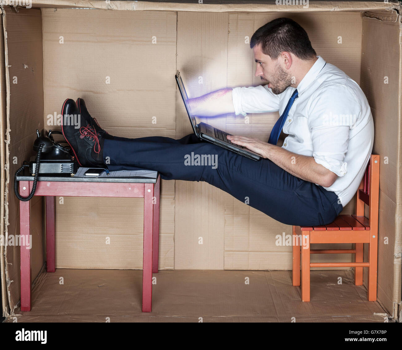 businessman pulled into work Stock Photo - Alamy