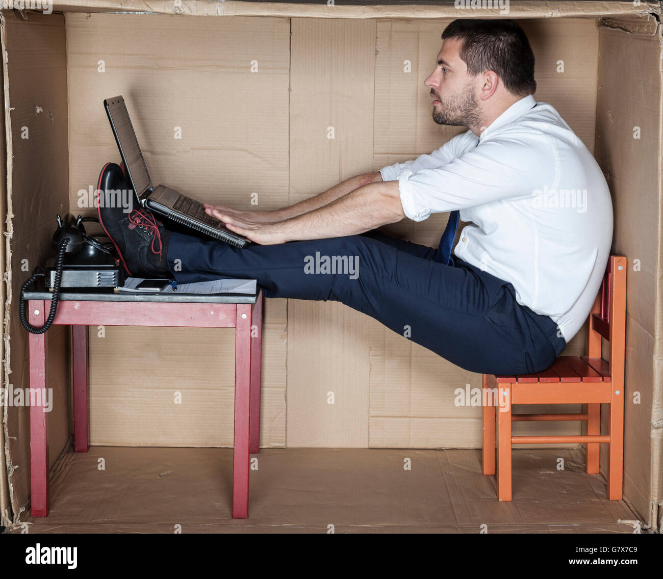 strange position at the desk Stock Photo - Alamy