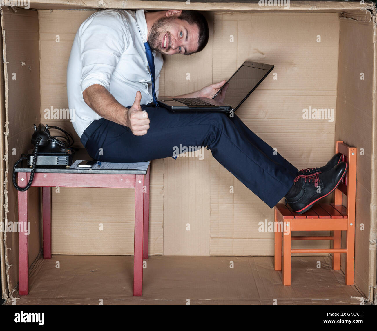 strange position at the desk, thumbs up Stock Photo - Alamy
