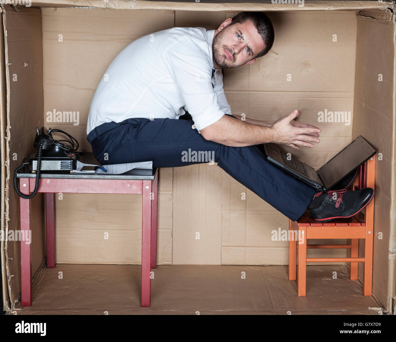 strange position to work, surprised businessman Stock Photo - Alamy