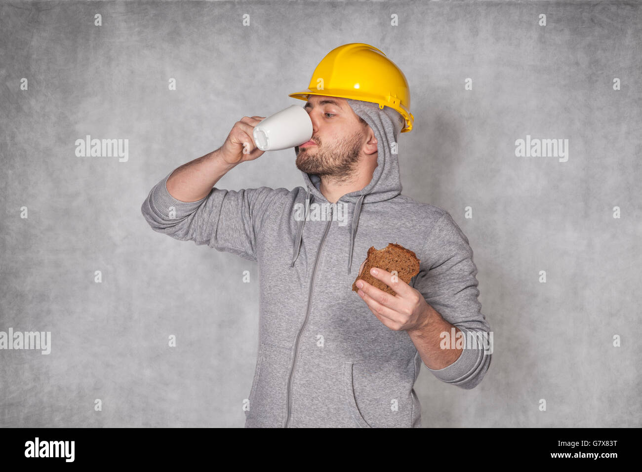 Worker drinking coffee during the break Stock Photo - Alamy