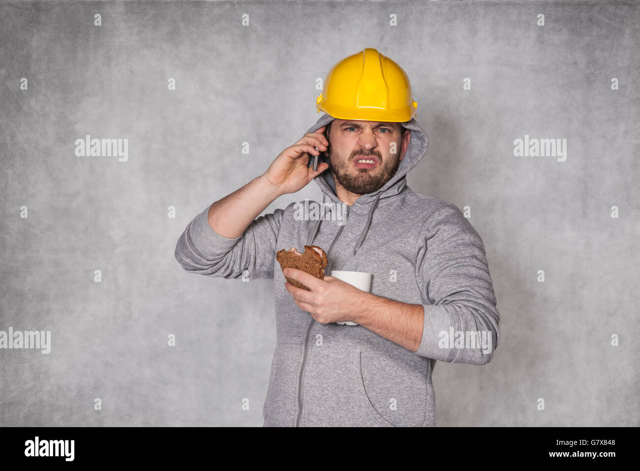 worker ate a sandwich and talking on the phone Stock Photo - Alamy