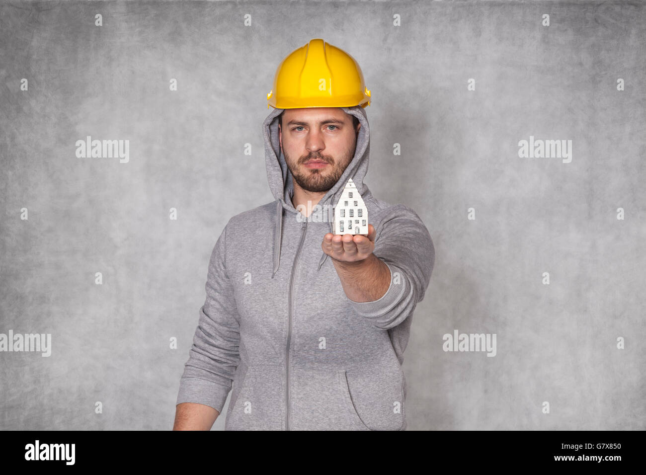 worker shows the perfect home for you Stock Photo - Alamy