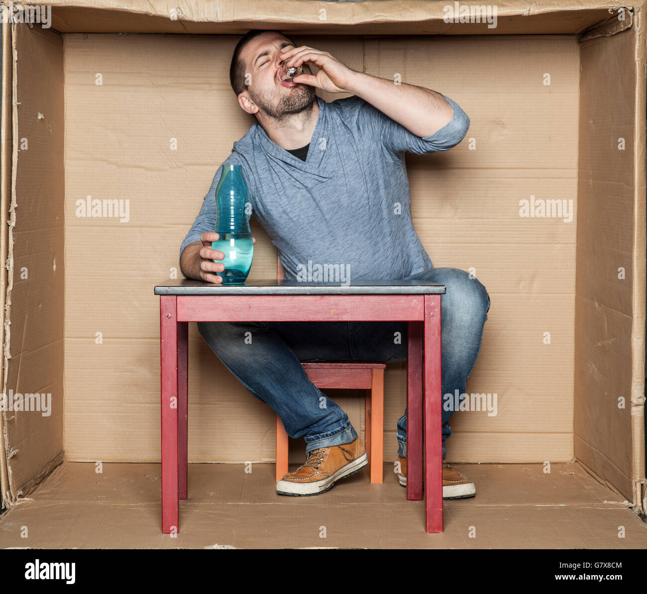 poor student drinks alcohol only Stock Photo - Alamy