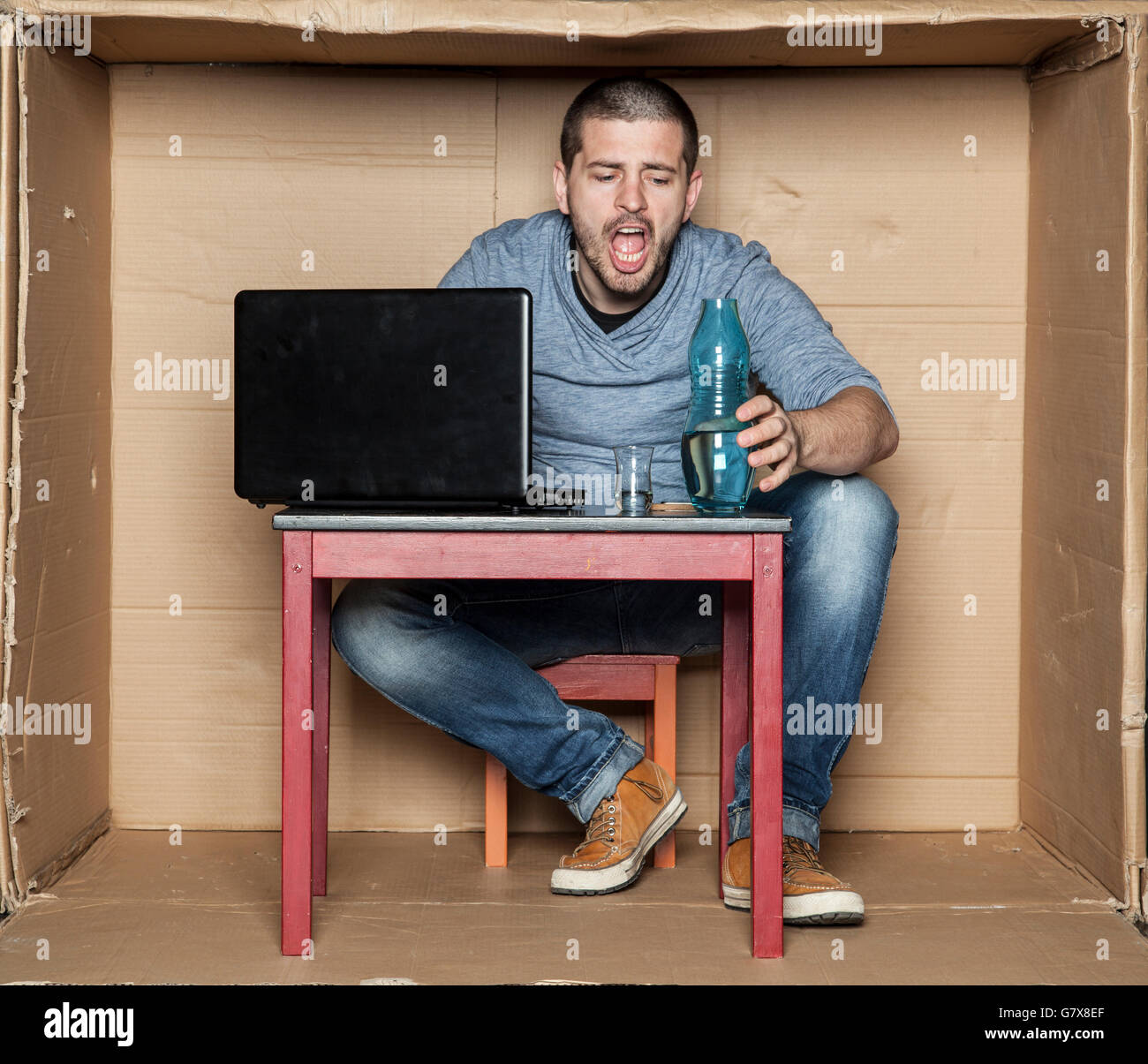 student grabs the bottle of alcohol Stock Photo - Alamy