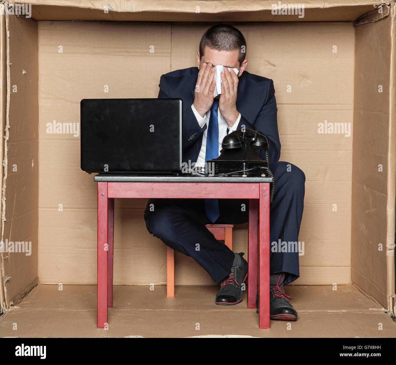 cold businessman working despite illness Stock Photo - Alamy