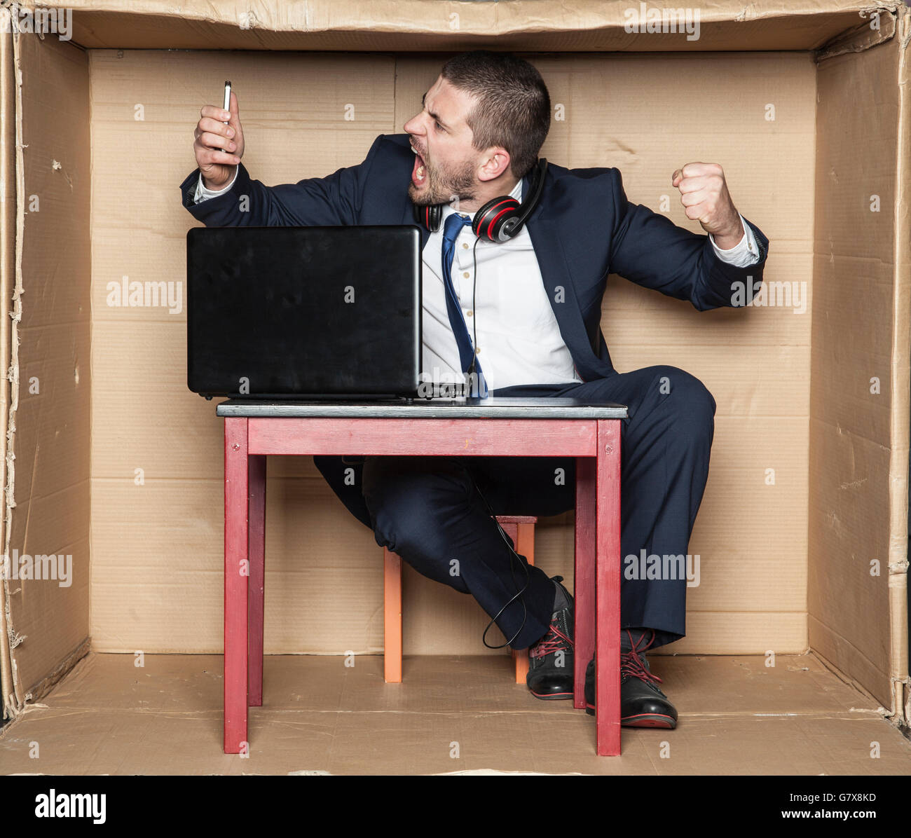 crazy employee customer service shouting into the phone Stock Photo - Alamy