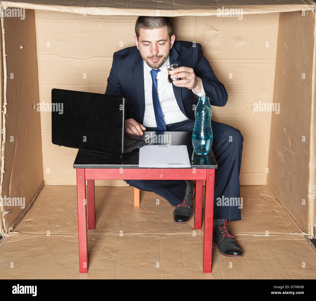 Drunk businessman reading a contract Stock Photo - Alamy