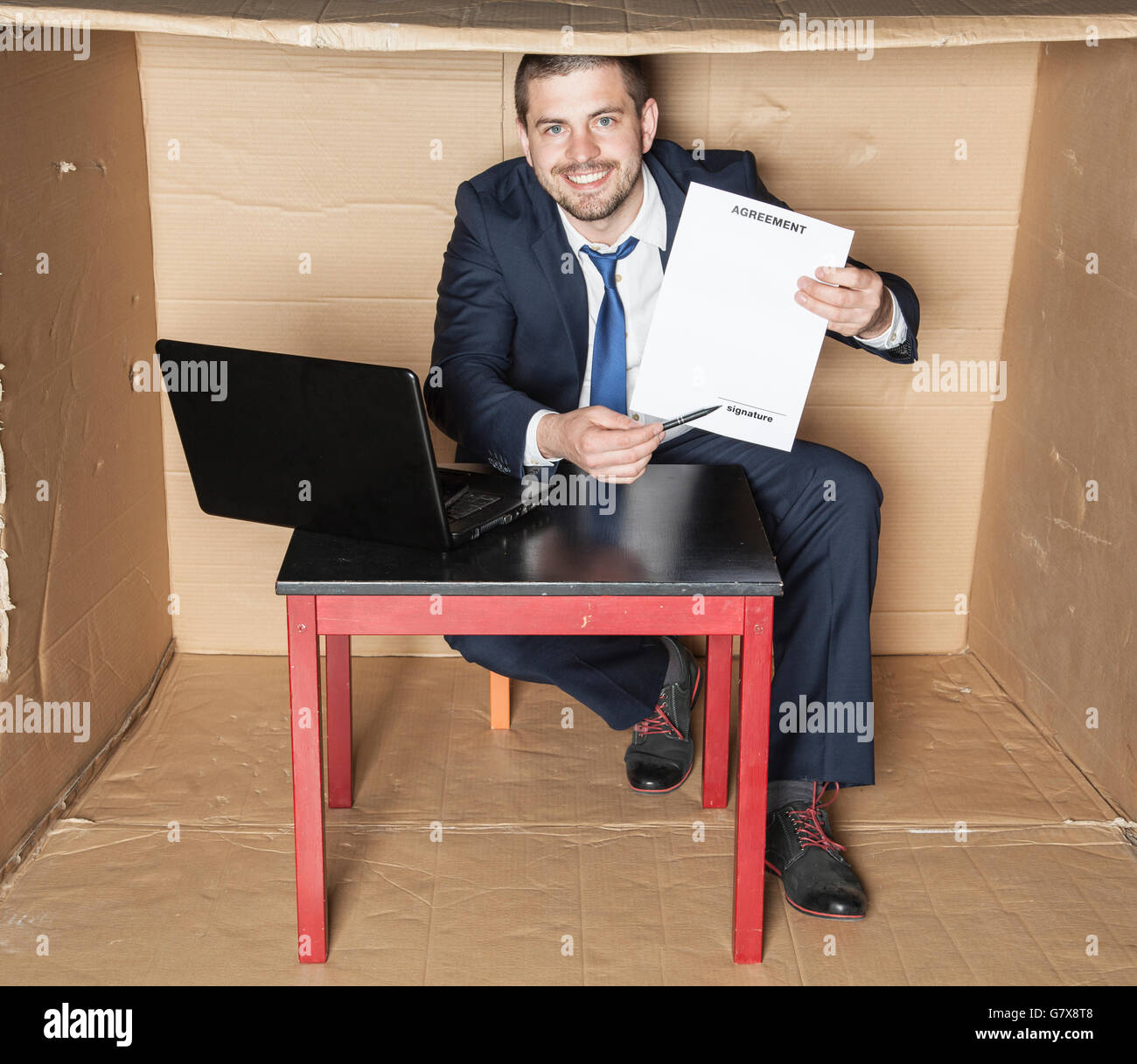 businessman shows where you must sign an agreement Stock Photo - Alamy