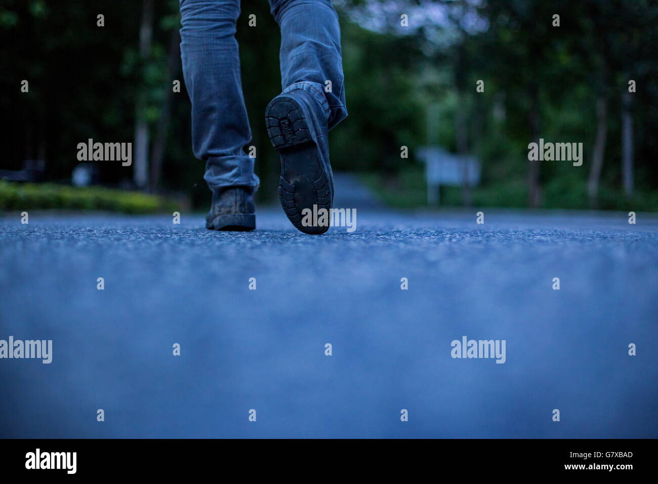 Abstract man walking on the road Stock Photo - Alamy