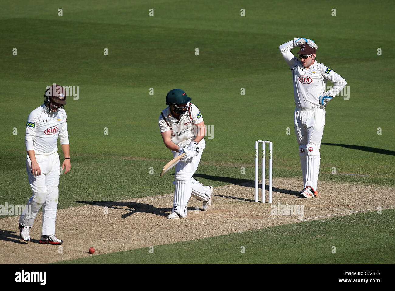 Surrey's Rory Burns (left) and wicketkeeper Gary Wilson react after and ...
