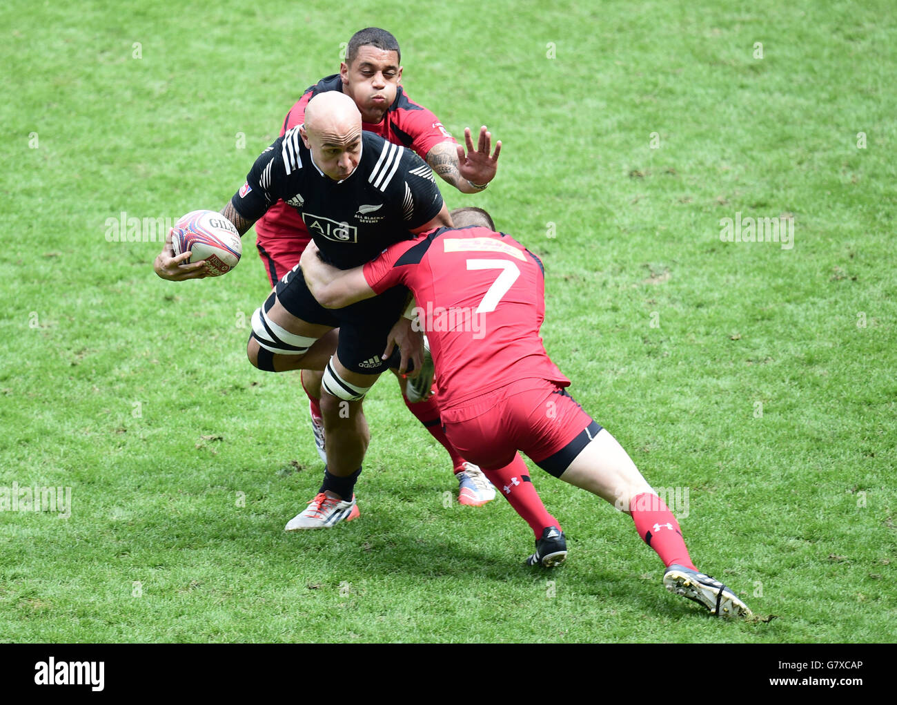 New Zealand's DJ Forbes is tackled by Canada's Matt Evans (no7) during ...
