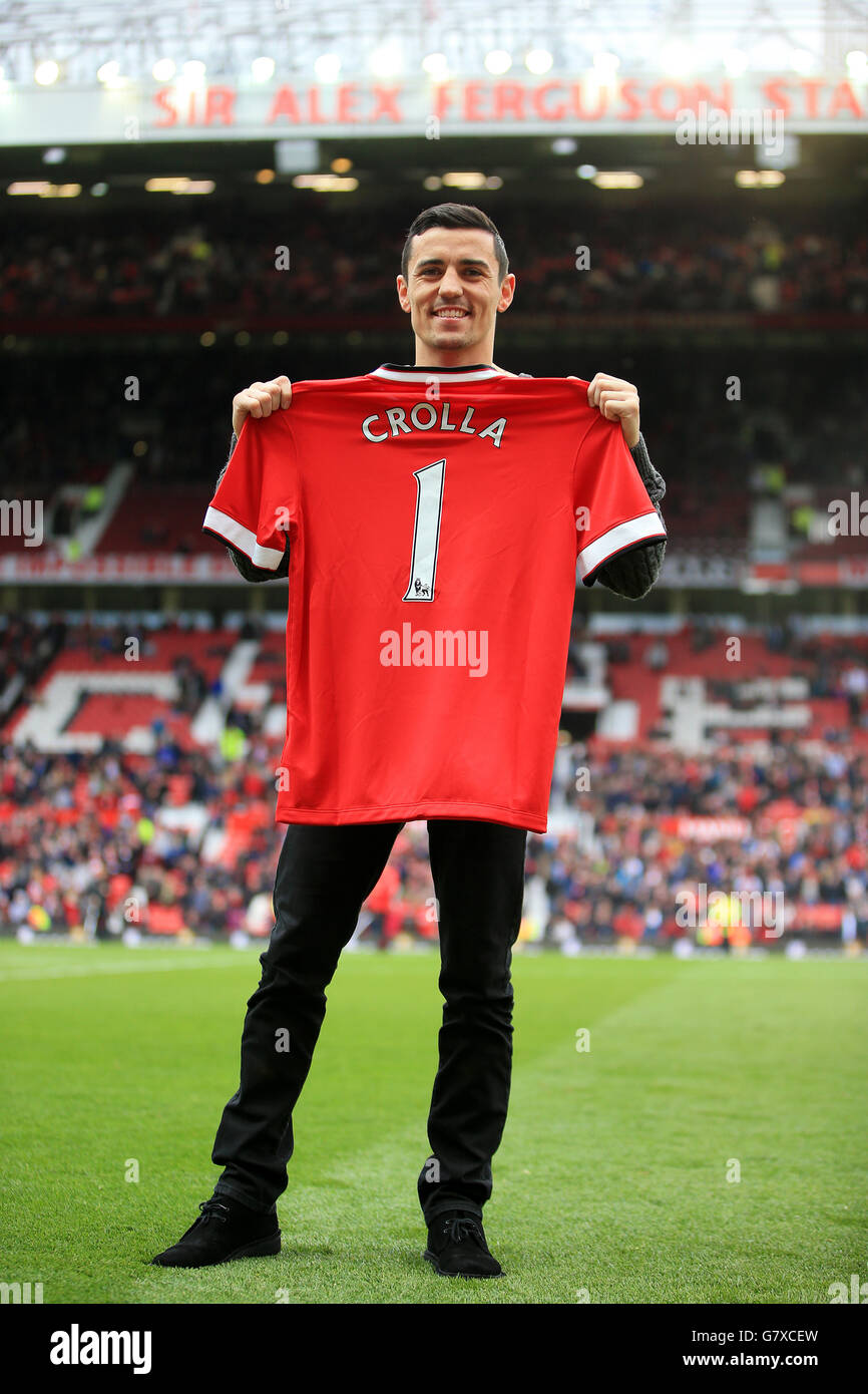 Boxer Anthony Crolla poses with a Manchester United shirt on the pitch ...