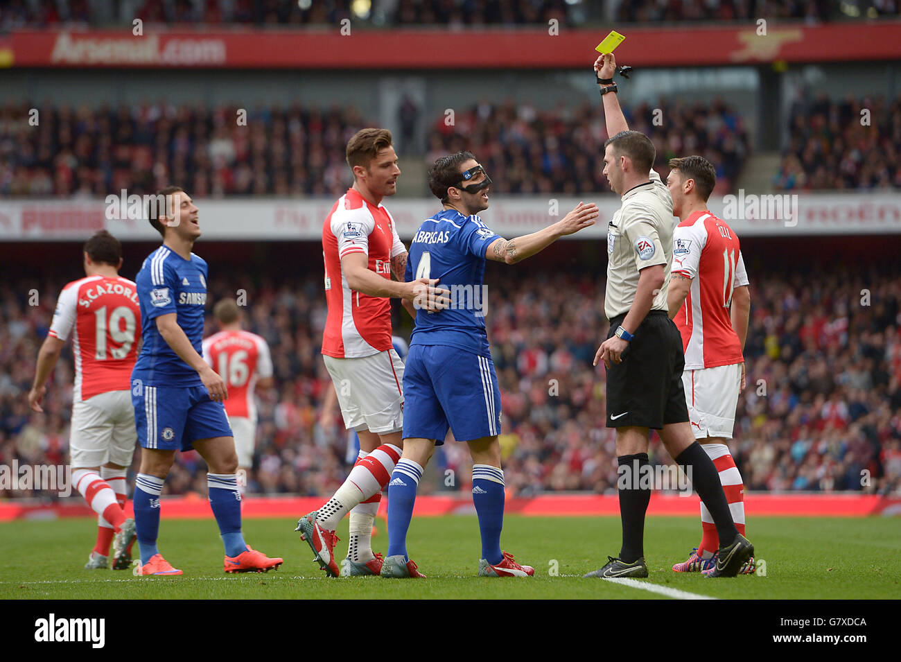 Referee Michael Oliver (second from right) shows Chelsea's Cesc ...