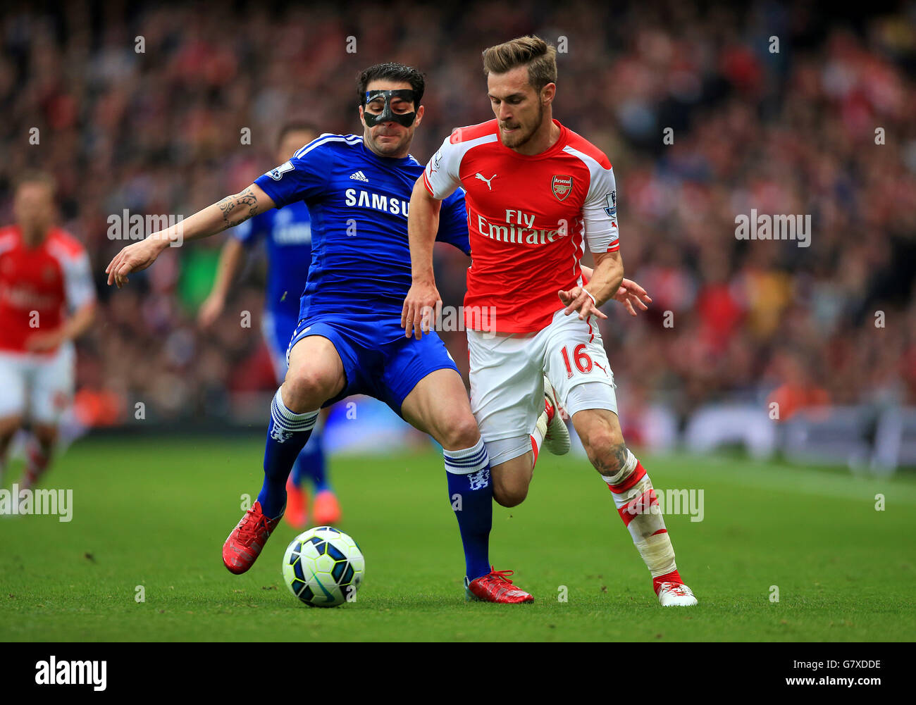 Chelsea's Cesc Fabregas (left) and Arsenal's Aaron Ramsey in action ...