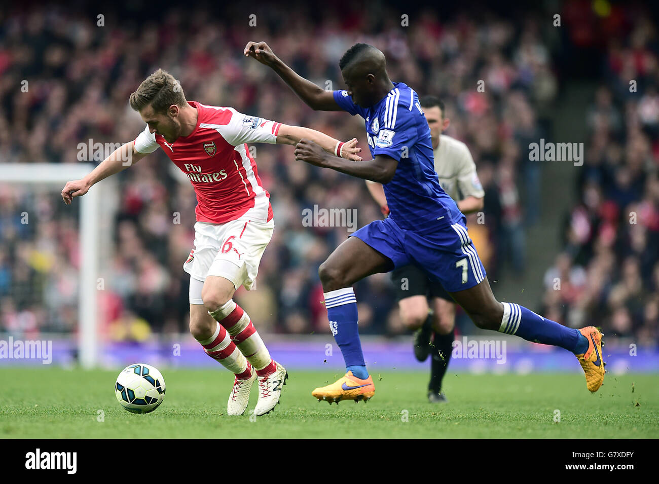 Arsenal's Aaron Ramsey (left) and Chelsea's Ramires (right) battle for ...