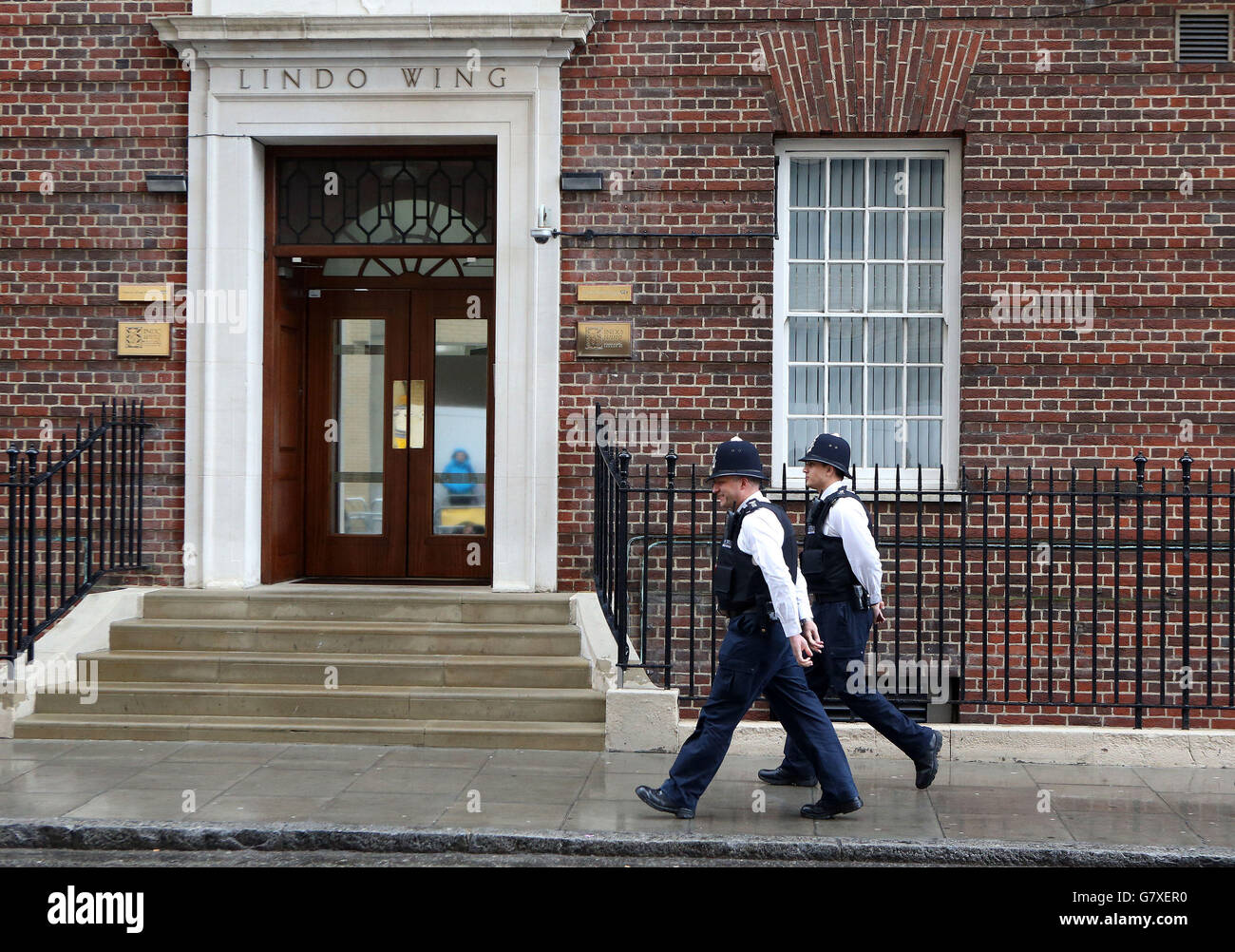 Police walk past the Lindo Wing in London where the Duchess of ...
