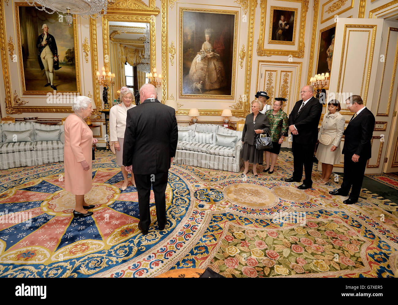 Queen Elizabeth II with American businessman John Mars and his wife ...