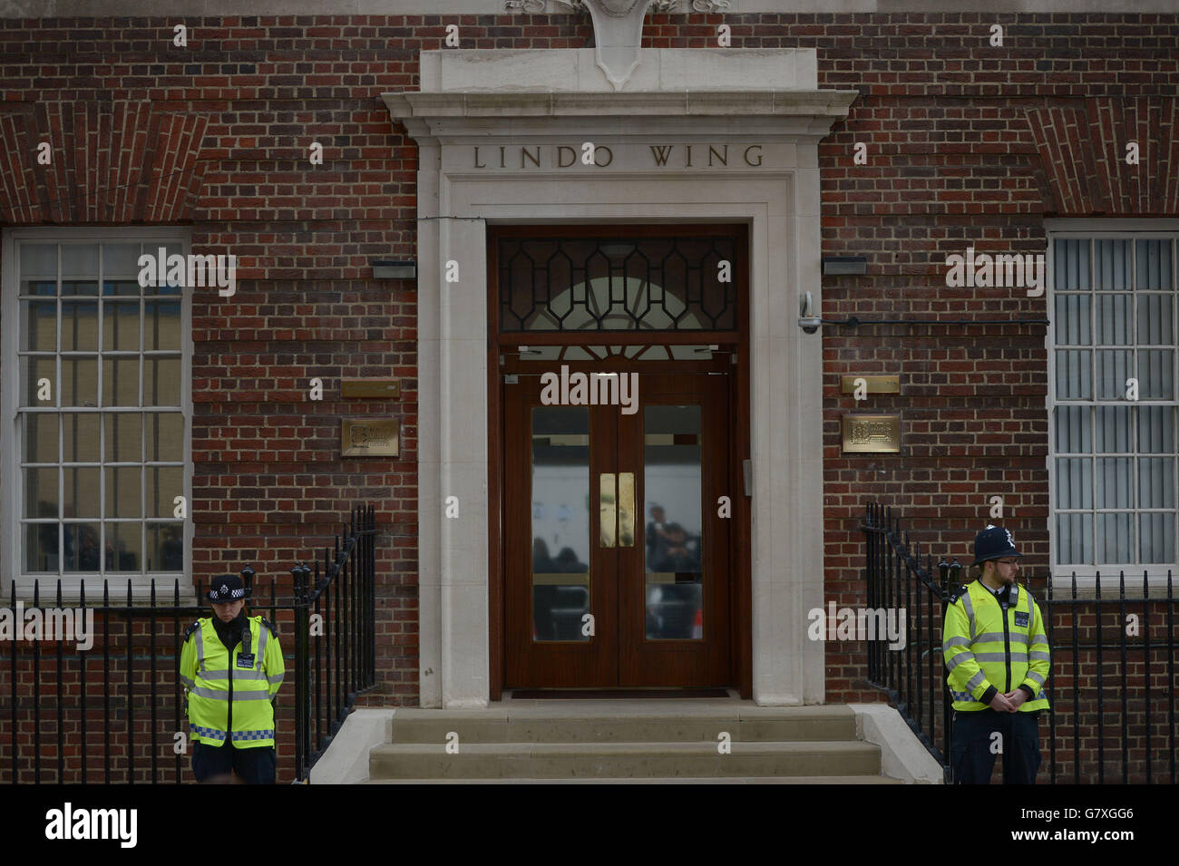 Police wait outside the Lindo wing of St Mary's Hospital in Paddington ...