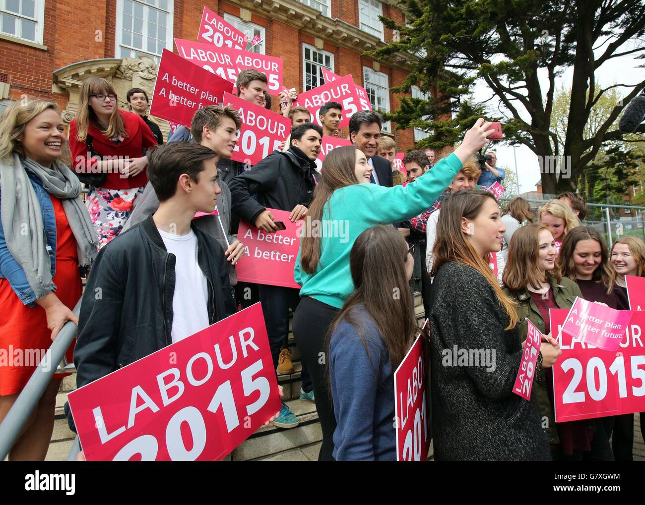 Labour Party leader Ed Miliband is greeted by Labour party activist as ...