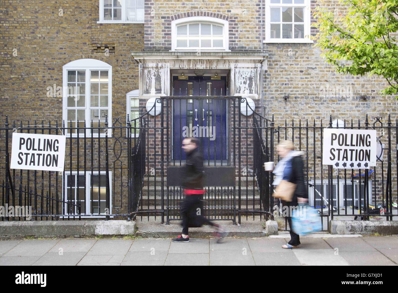 Voters visit a polling station at Hanover Primary School, Islington ...