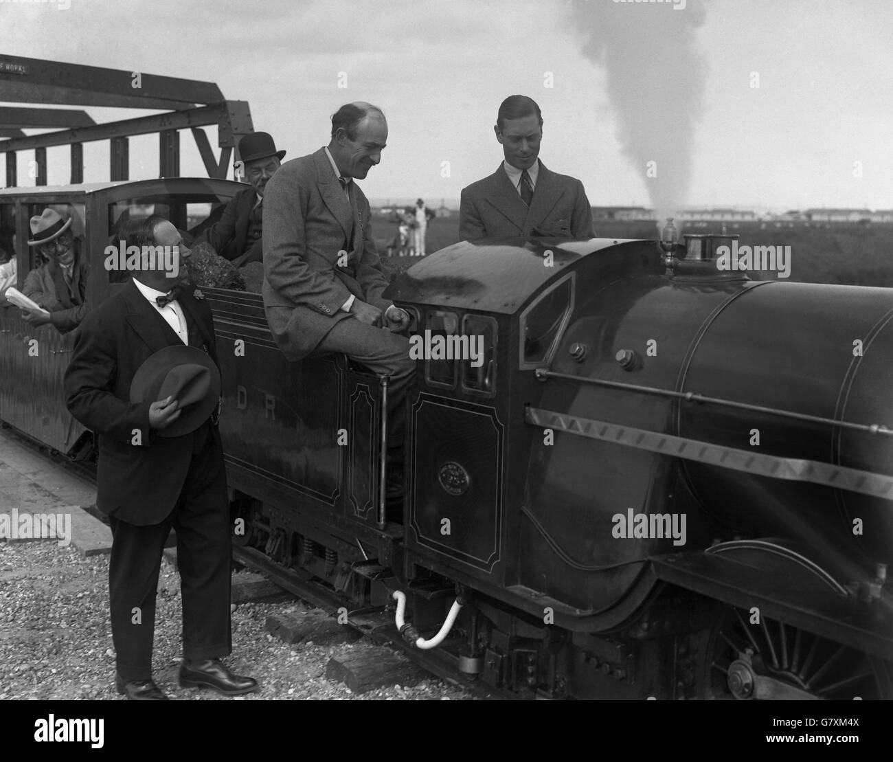 The Duke of York on the miniature engine at the boys' camp in New ...