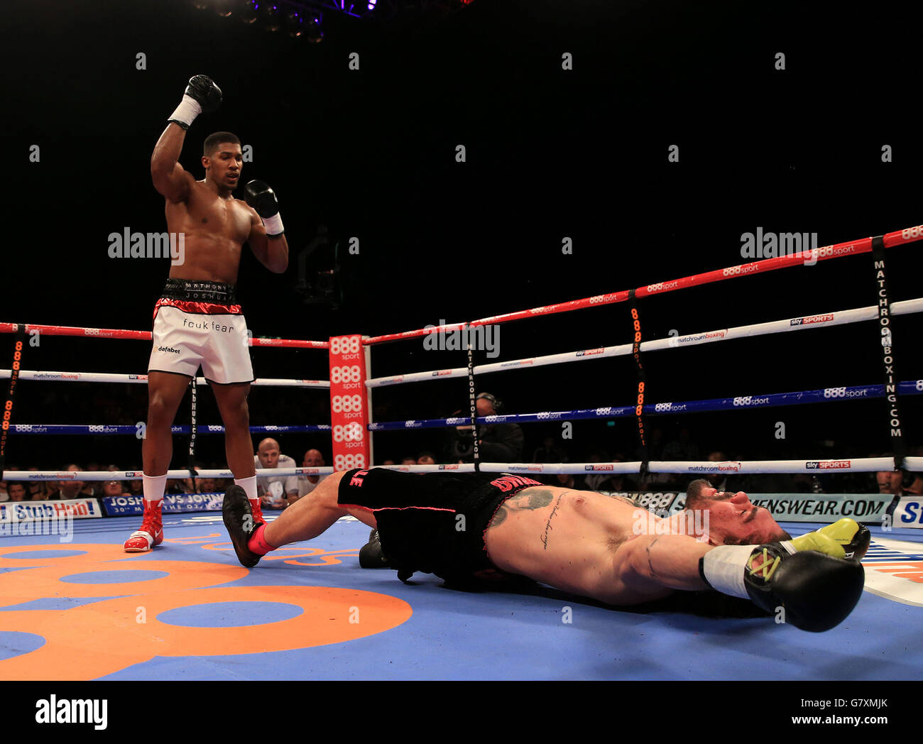Anthony Joshua (left) celebrates knocking down Rafael Zumbano Love ...