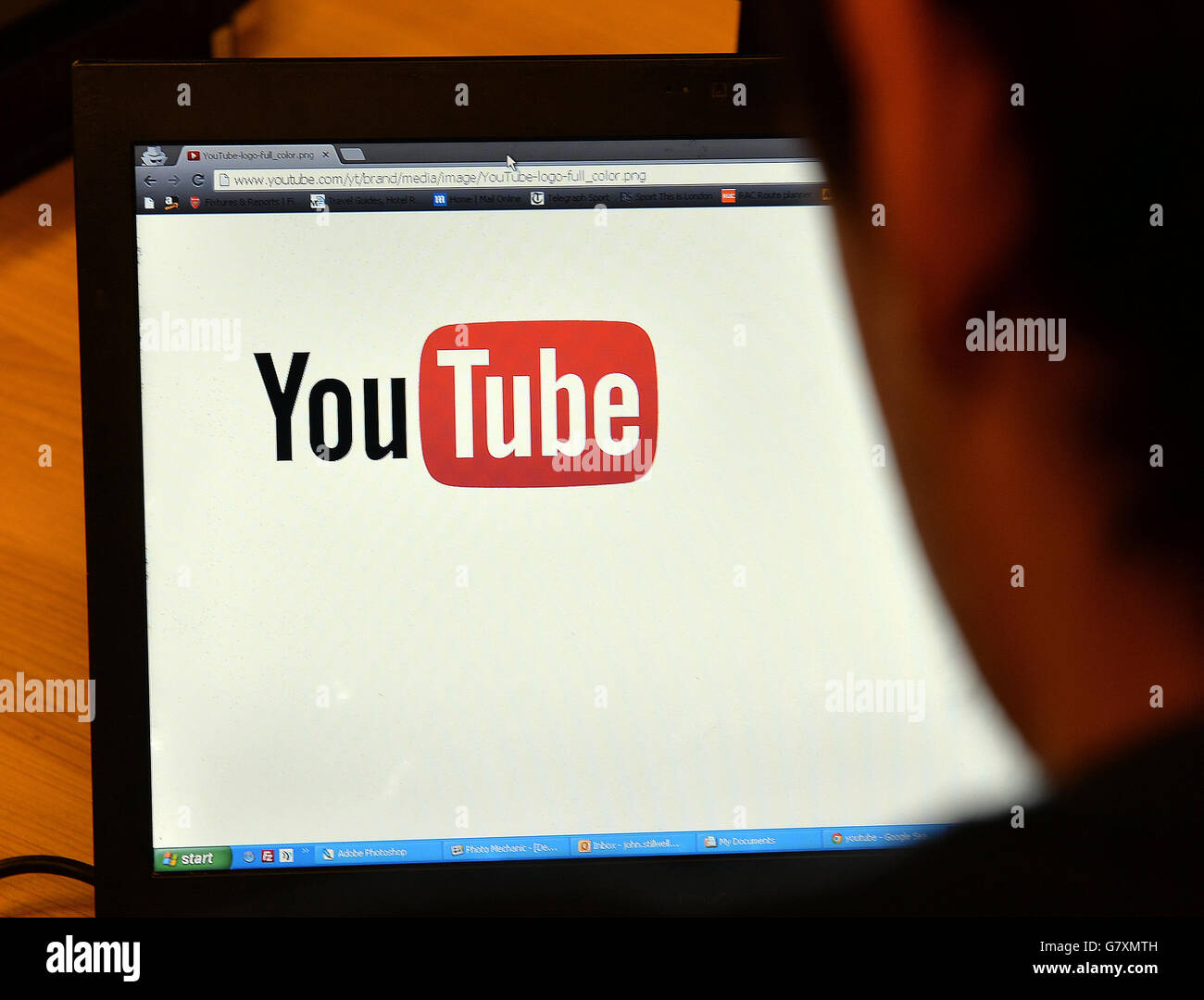 A man uses YouTube which is marking the tenth anniversary of its ...