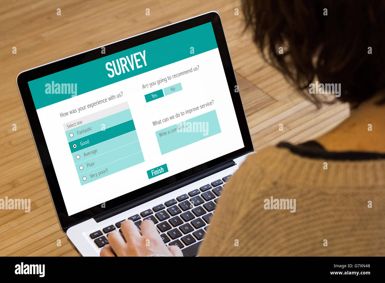 Young woman filling a survey form with laptop. All screen graphics are ...