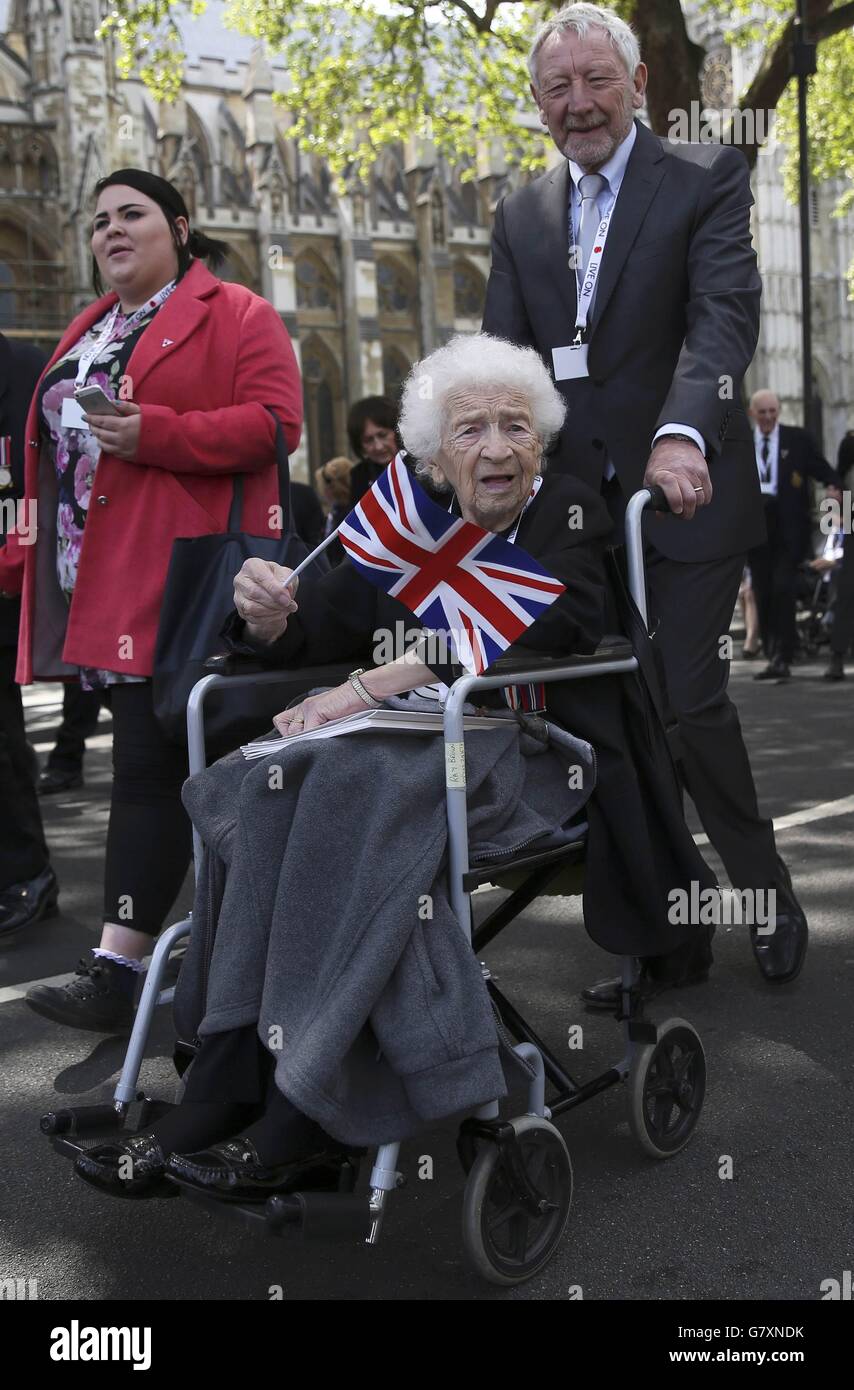 A veteran waves a Union Jack flag as she takes part in the VE Day ...