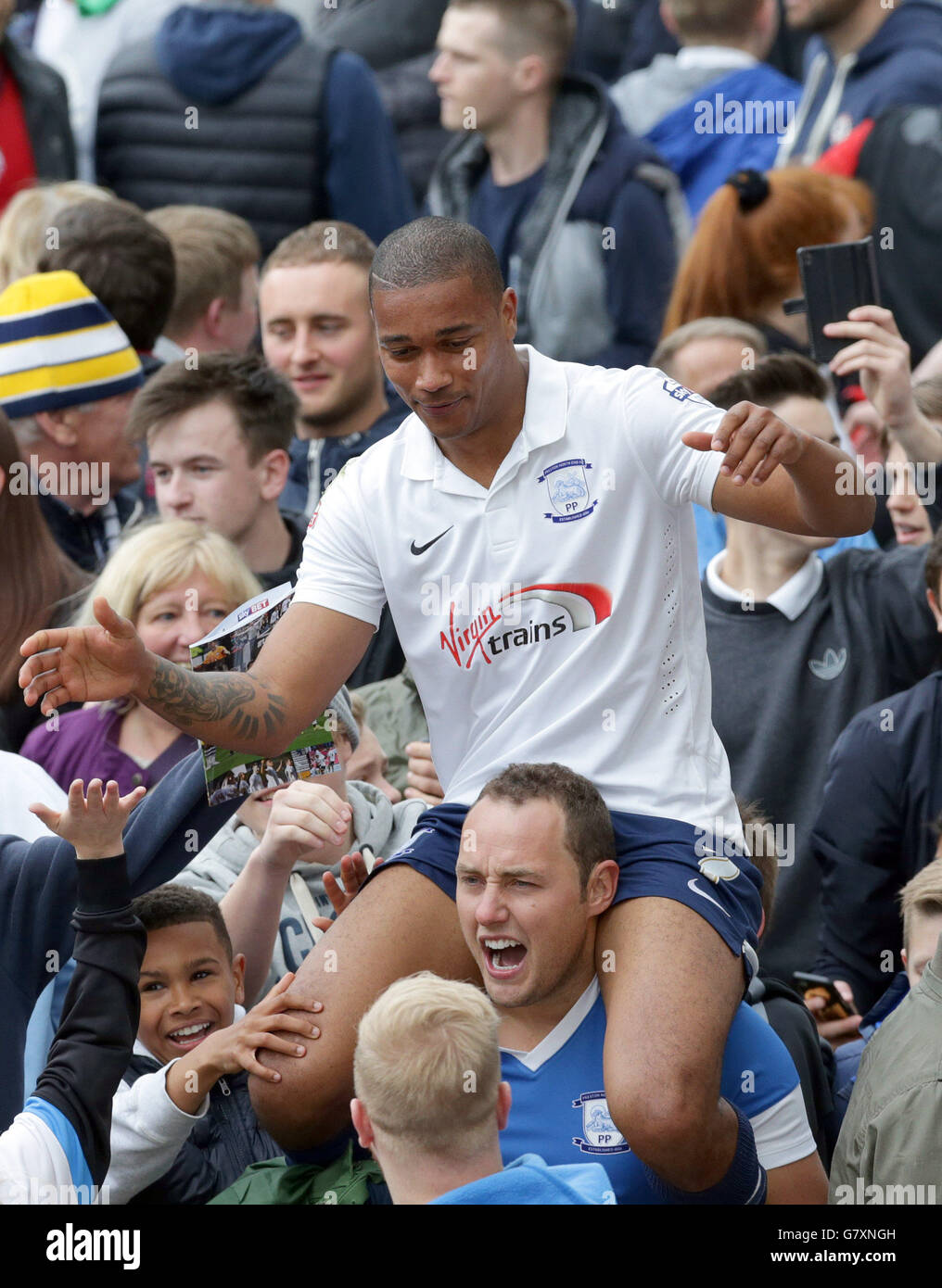 Preston North End's Chris Humphrey is carried off the pitch by the fans ...
