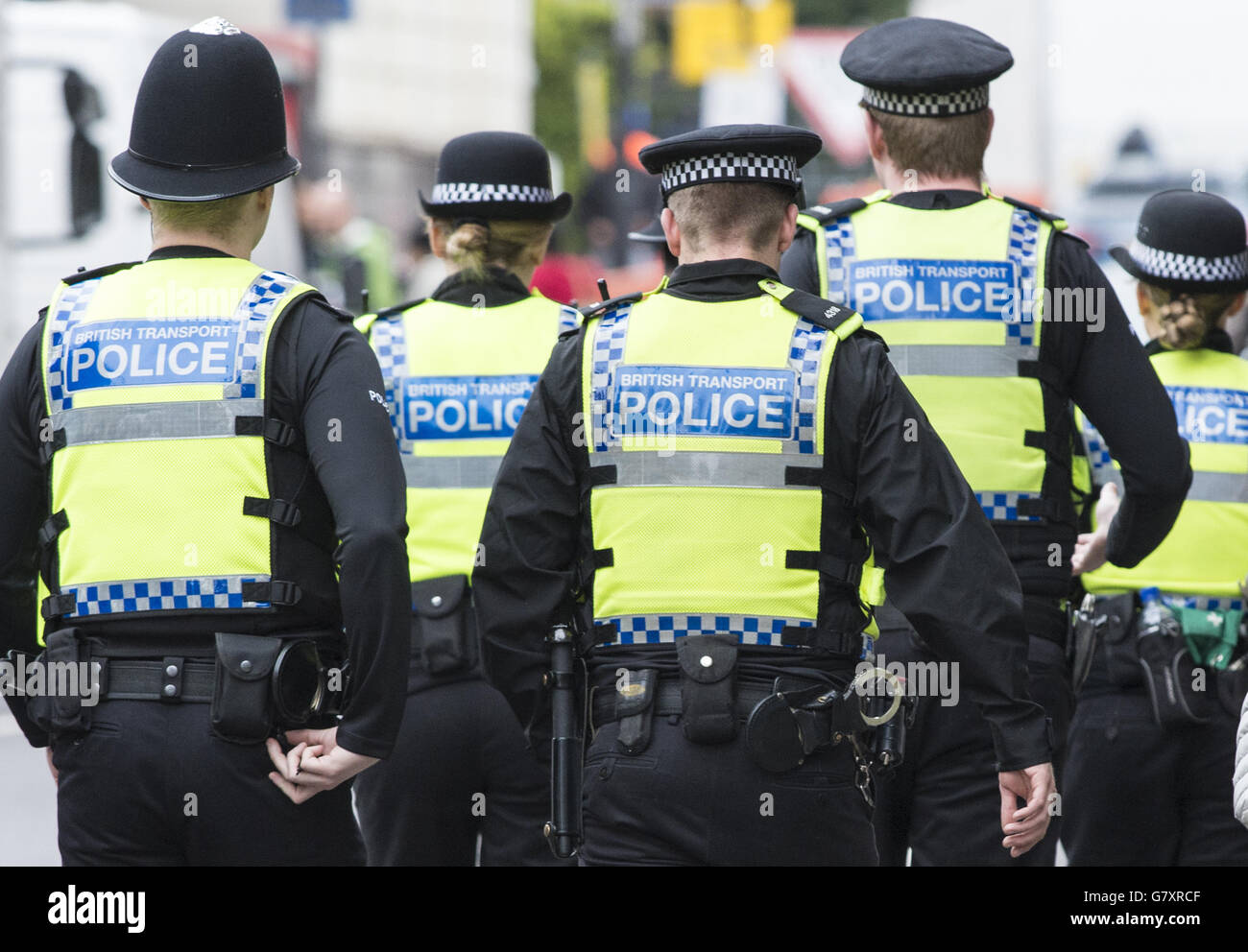Five british transport police officers patrol the street in highbury hi ...